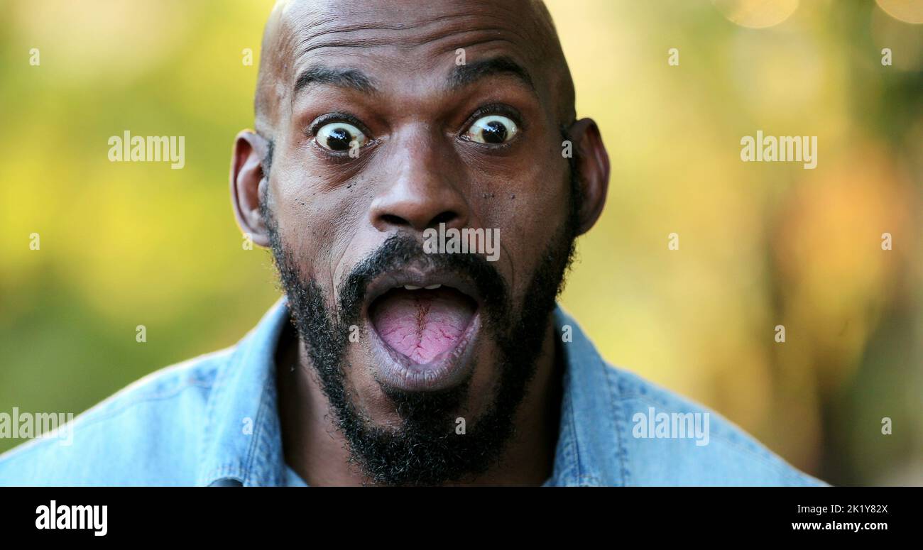 Black man surprise reaction, African guy portrait happy WOW Stock Photo ...