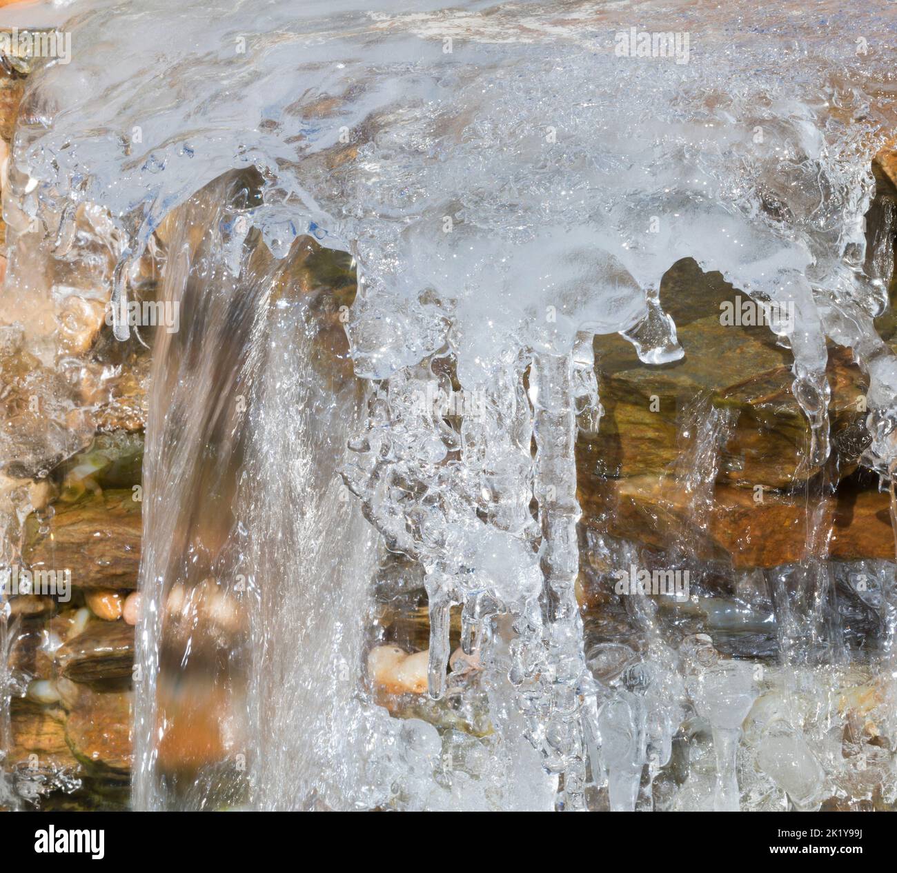 Ice formed over a small cascade after the snow bomb cyclone in North ...