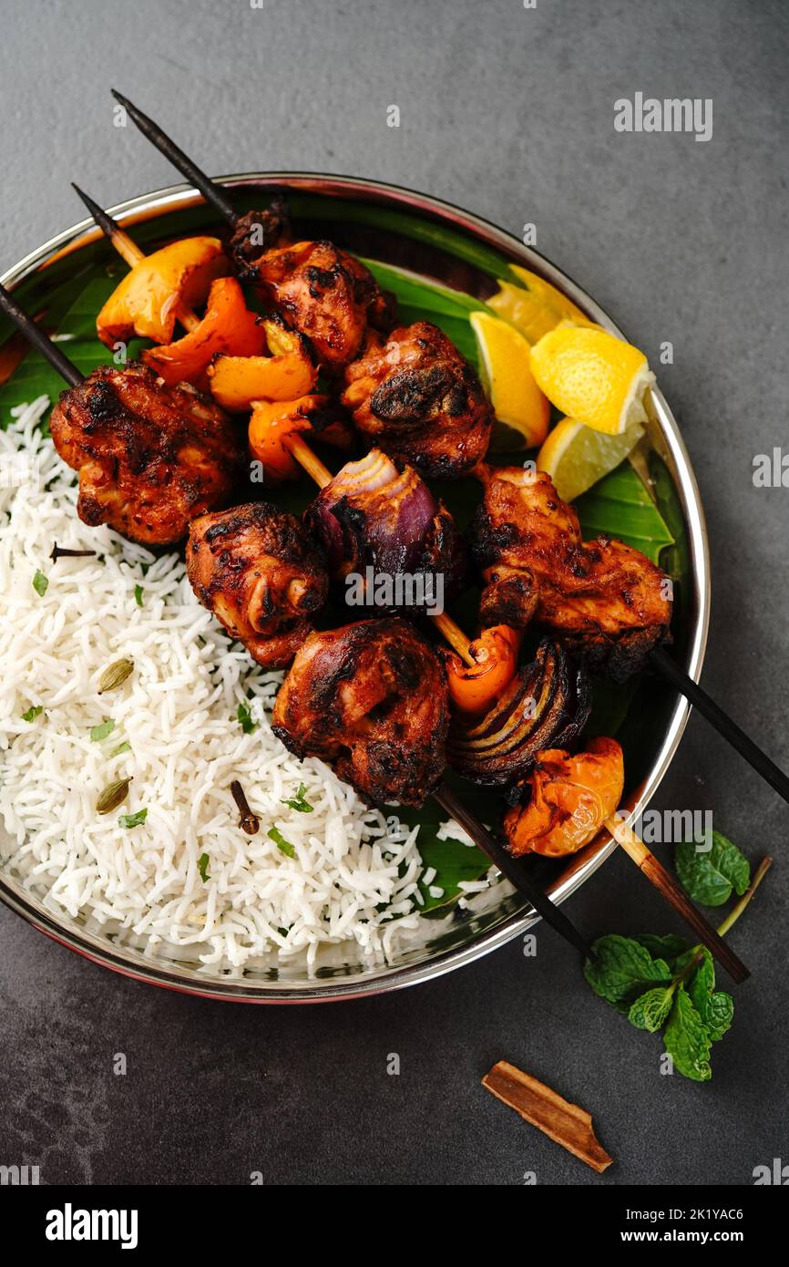 Grilled chicken tikka kabab served with basmati rice overhead view ...