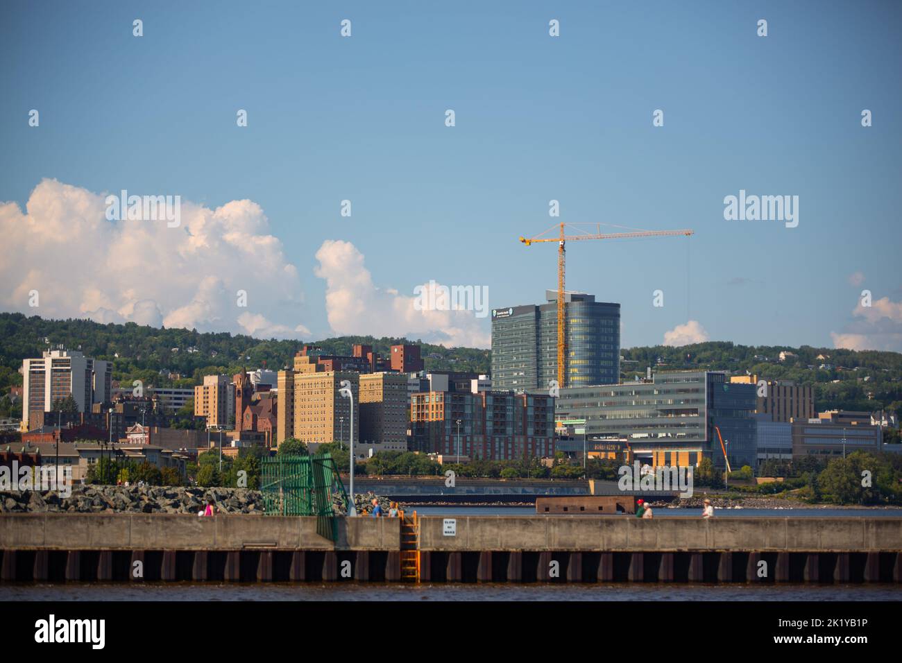 The skyline of Duluth city with modern buildings, port, and a yellow ...