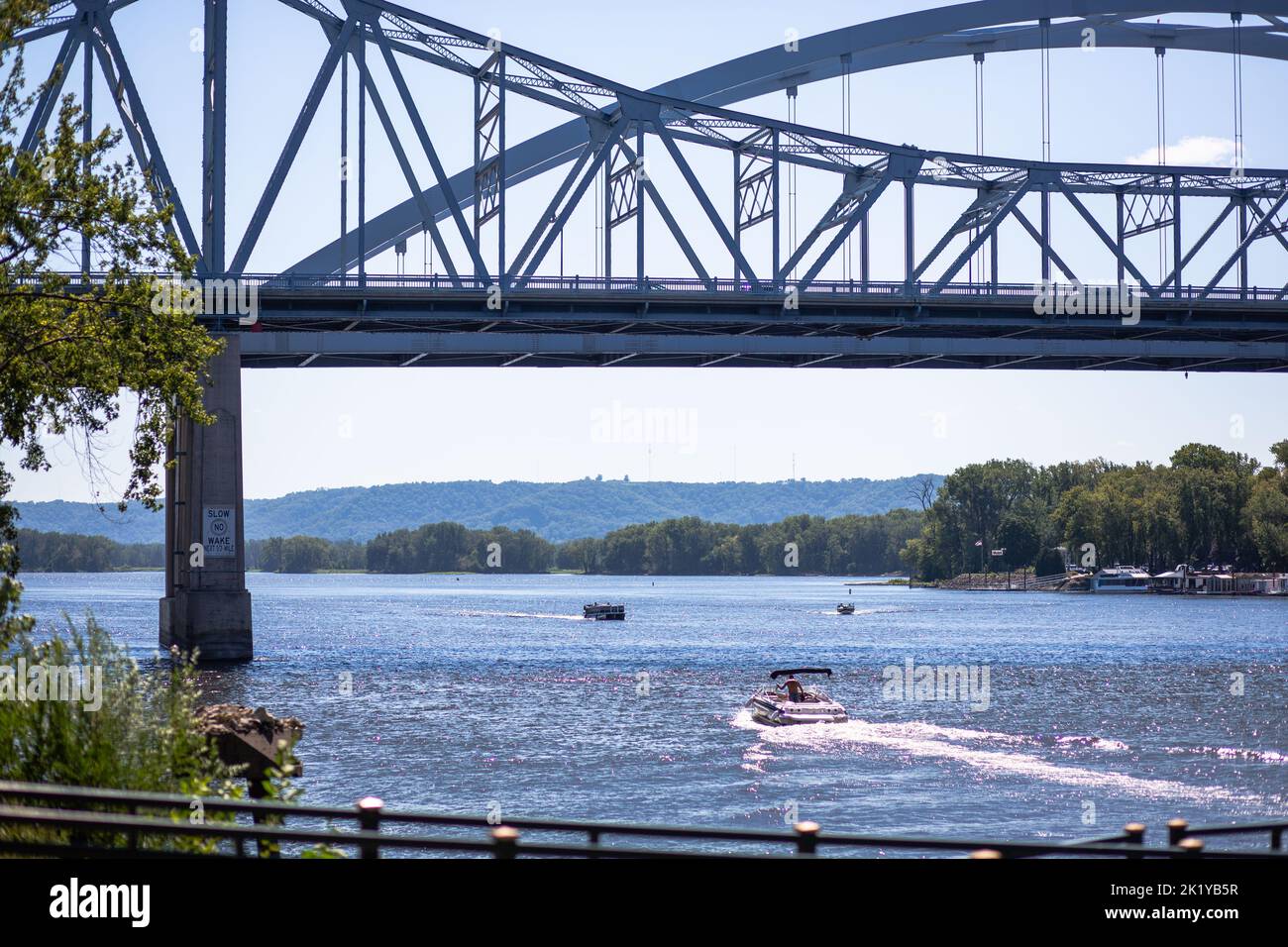 Boats sailing under the Mississippi River Bridge in La Crosse ...