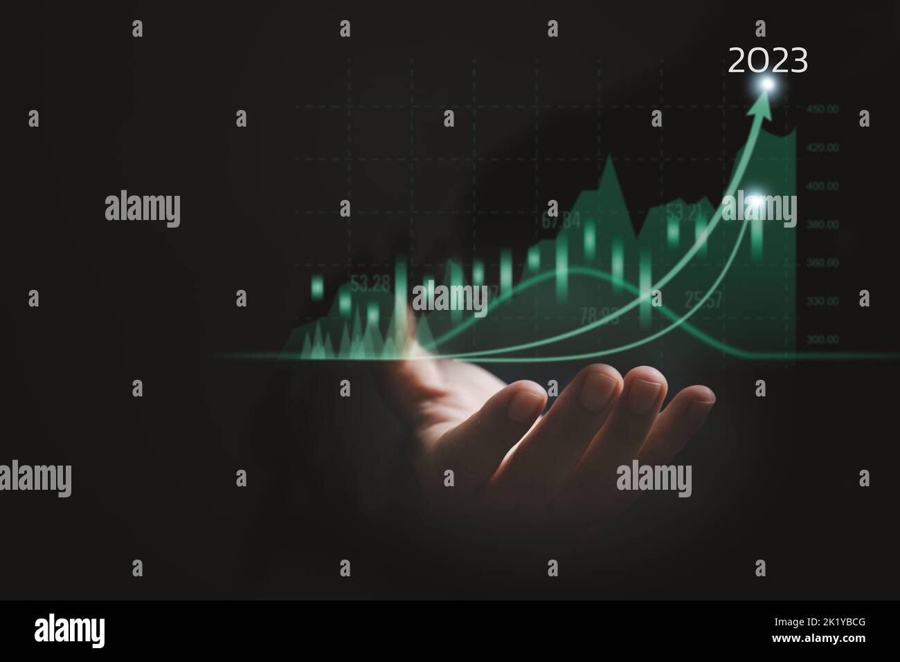Businessman holding growth data chart arrow with 2023 budget diagram ...
