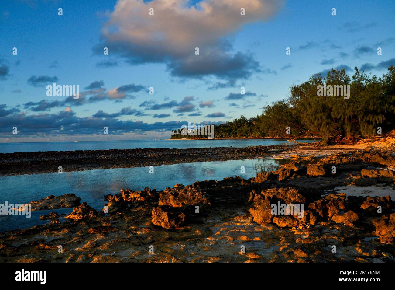 Remote tropical beach on the sunset with rocks on the Desroches Island ...