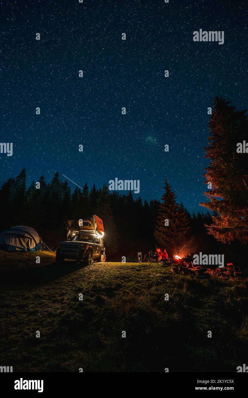 A mesmerizing vertical view of a camping site in the Apuseni Mountains ...
