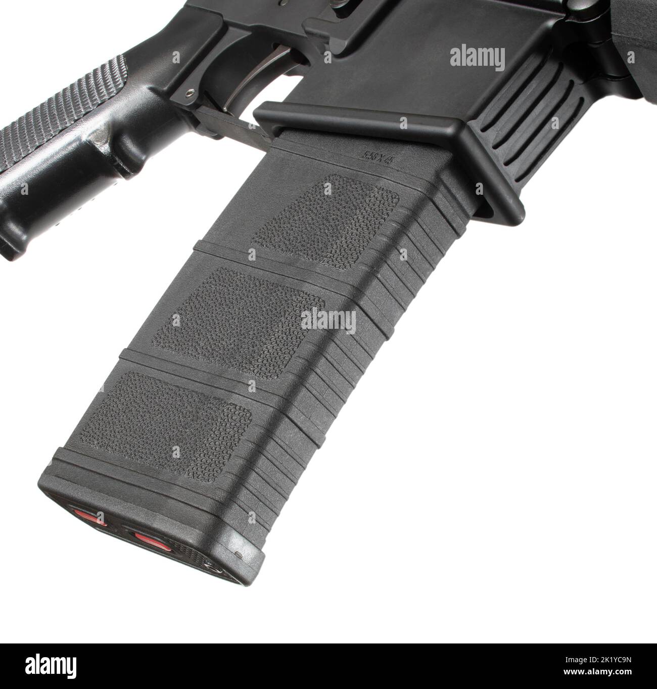 High-capacity magazine inserted in an assault rifle isolated on white ...