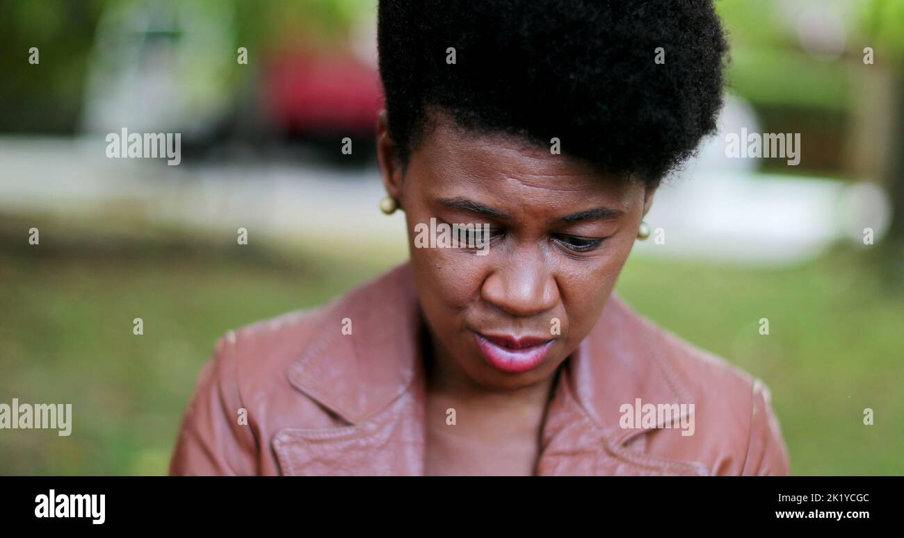 Worried black African woman emotional problems Stock Photo - Alamy