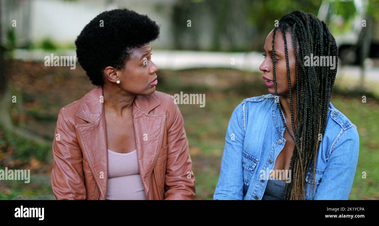 Two African women talking outside. People conversation at park Stock ...
