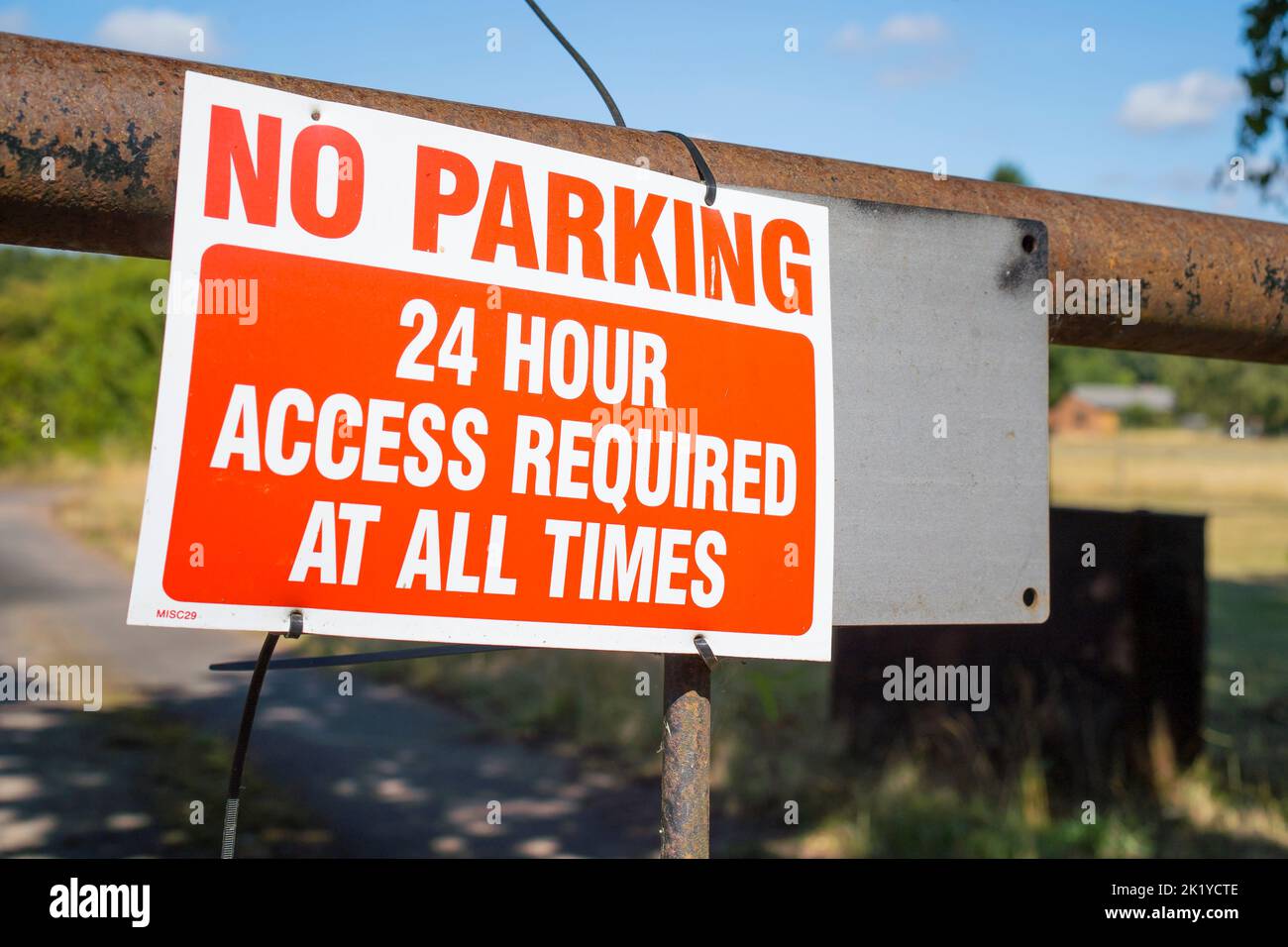 Red & white No Parking sign isolated on outdoor gate in UK countryside ...