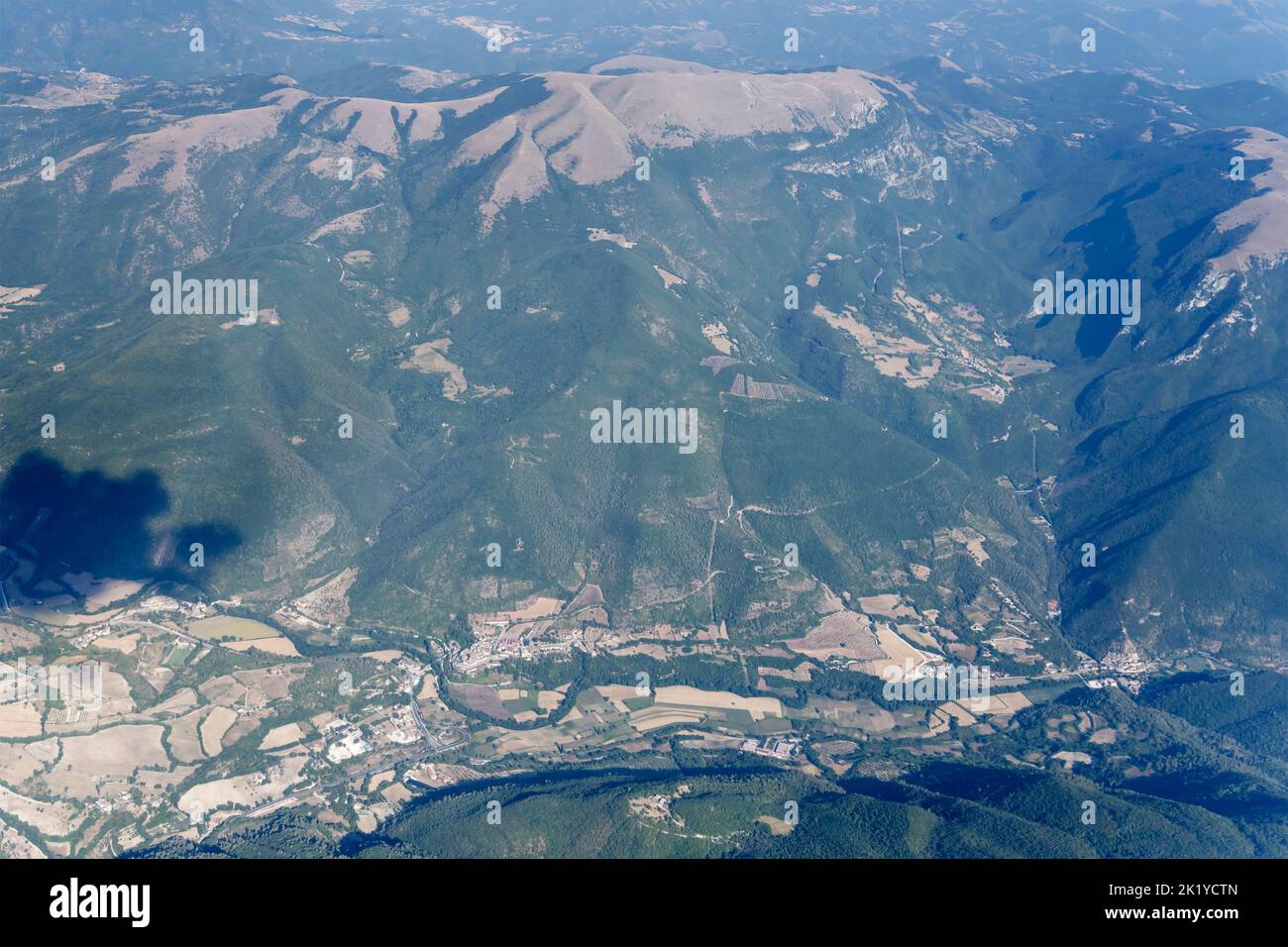 aerial shot, from a small plane, of S. Anatolia di Narco village in ...