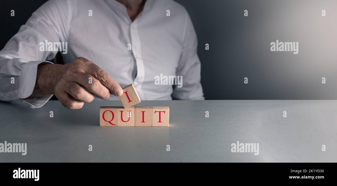 Man posing wooden blocks with I quit concept of leaving job resignation ...