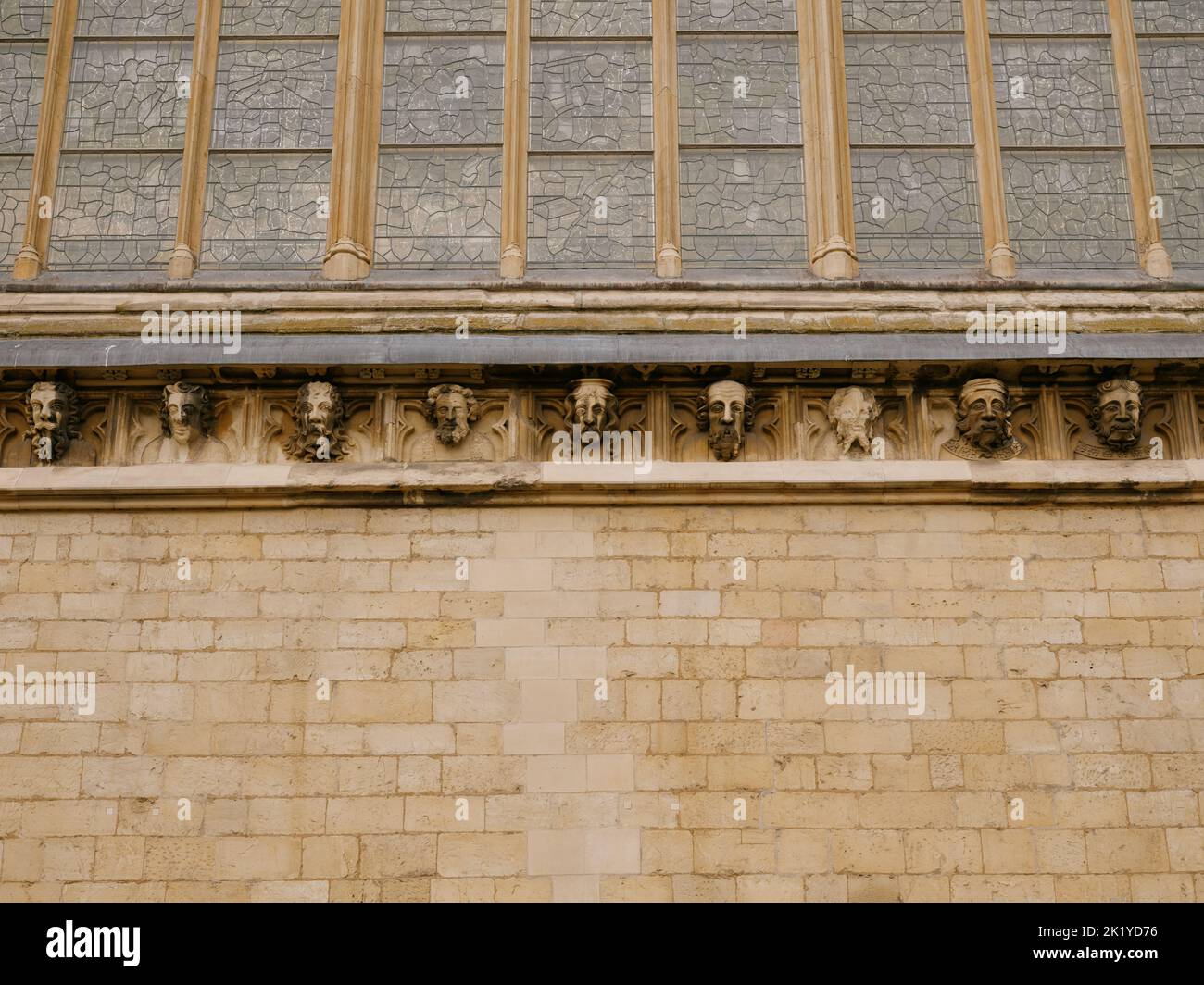 Architecture detail with stone heads and window of York Minster / York ...