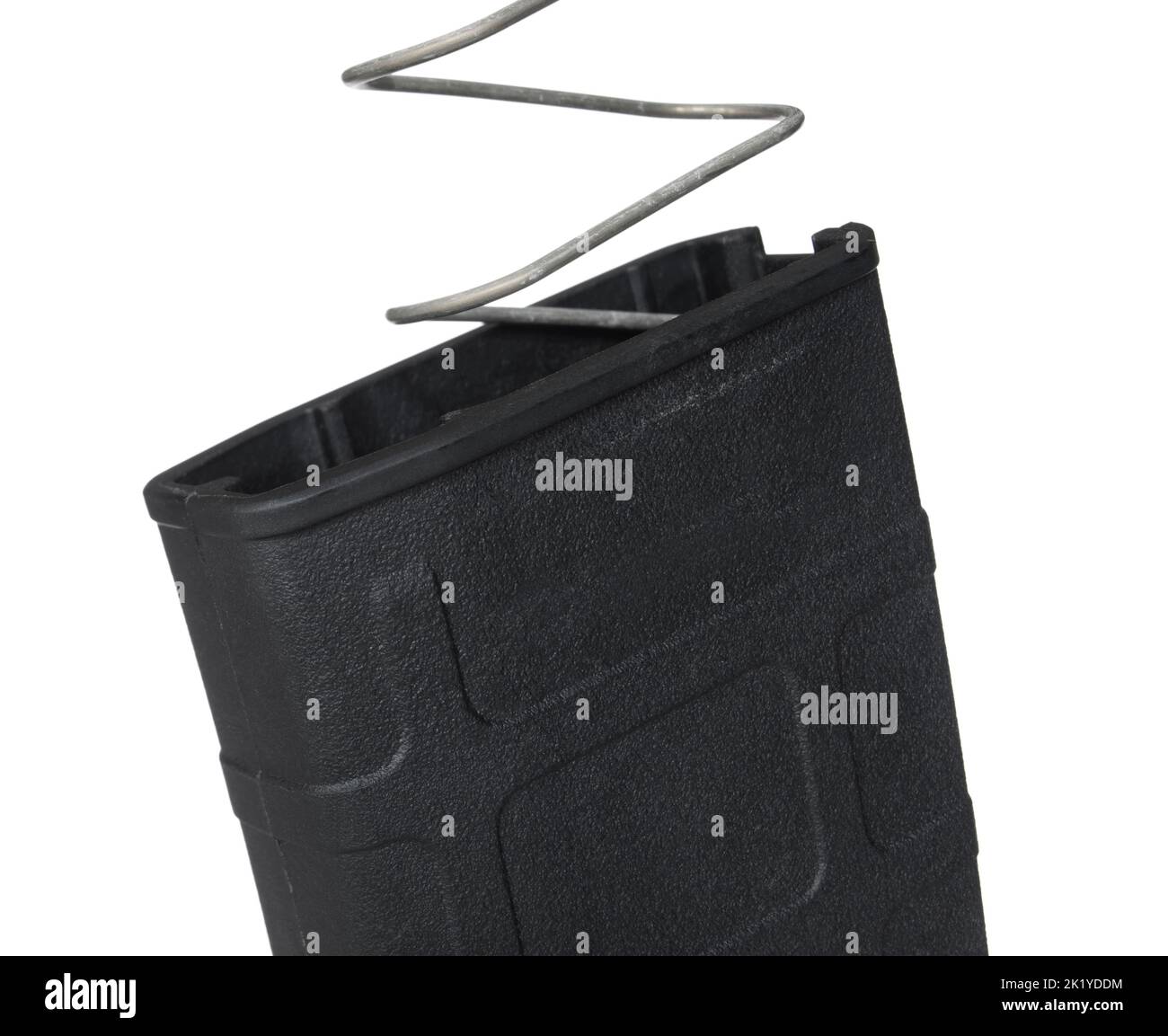 Spring in an AR-15 magazine released from the bottom isolated on a ...