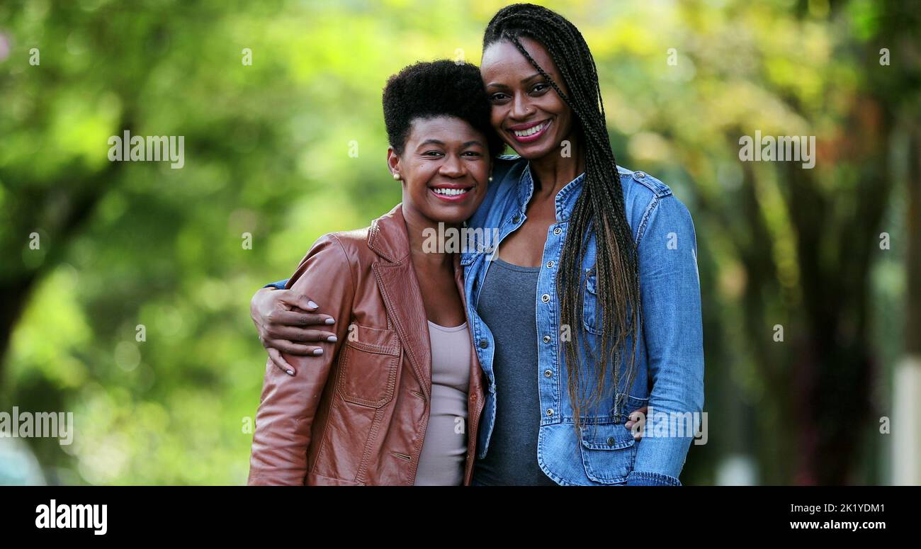 Two African friends smiling at camera. Black women together Stock Photo ...