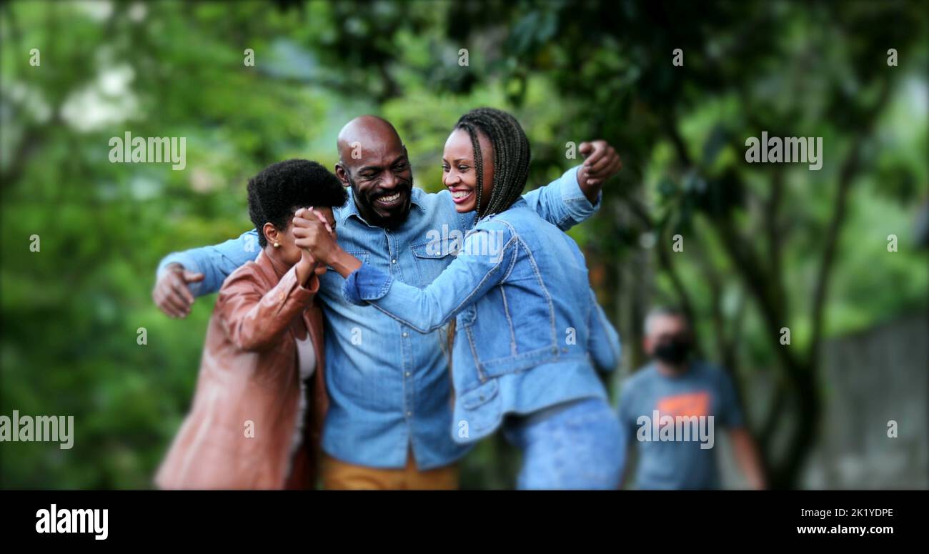 People building community group. three friends celebrating and hugging ...