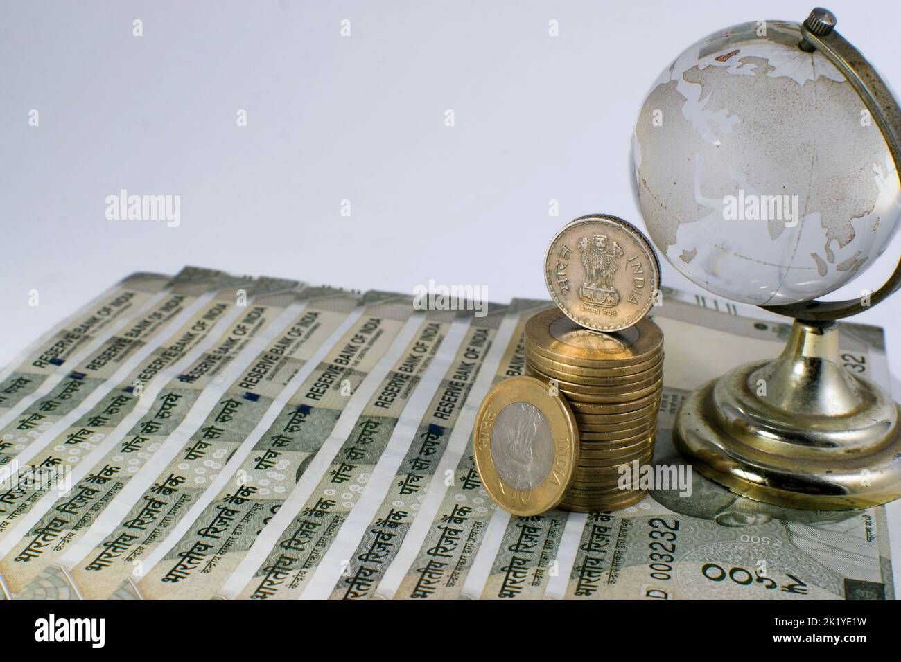 Glob with coins hi-res stock photography and images - Alamy