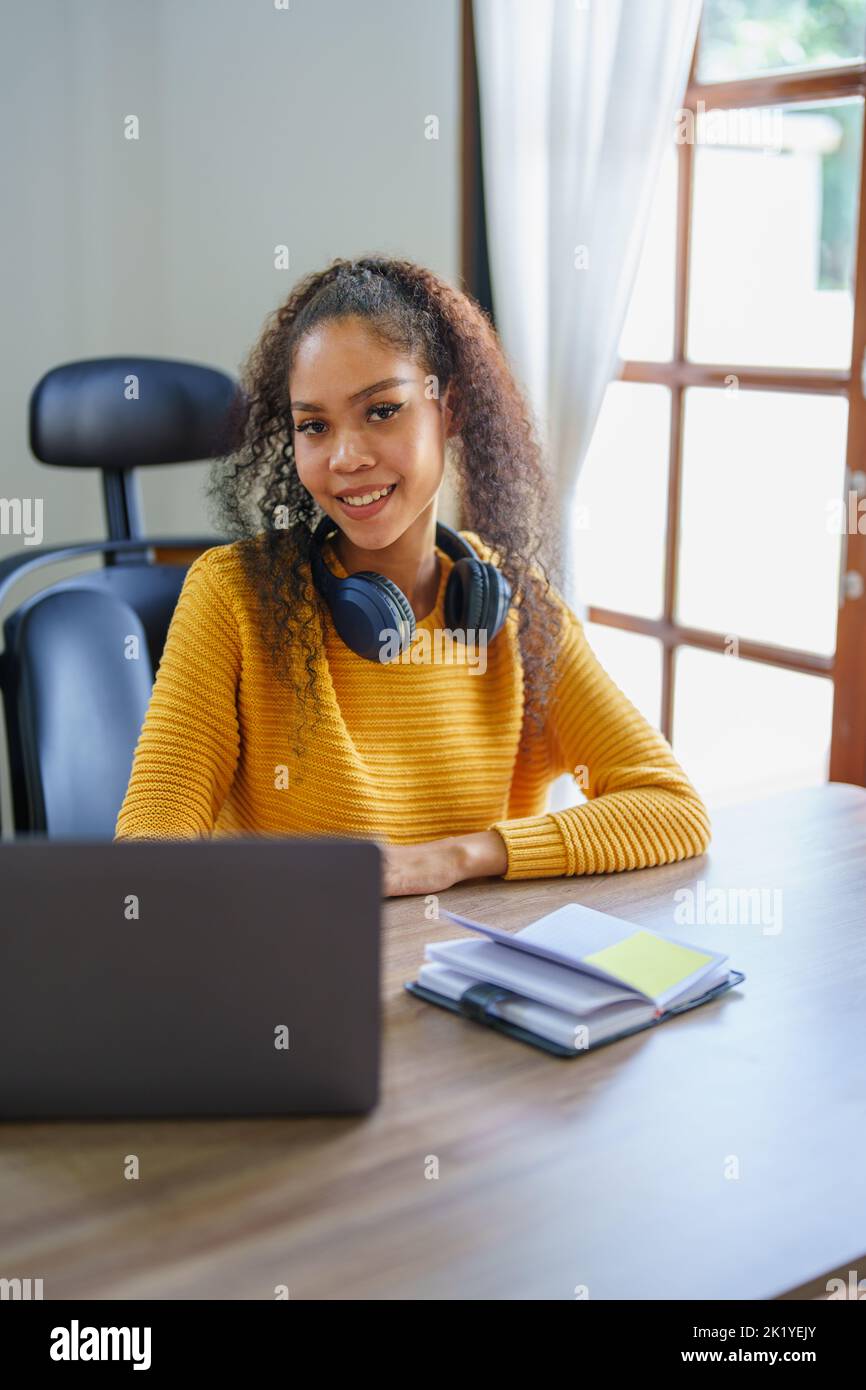 African Americans using notebooks, pens to take notes and computers ...