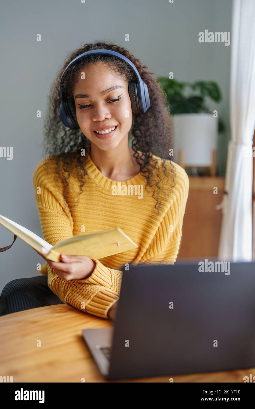 African Americans using notebooks, pens to take notes and computers ...