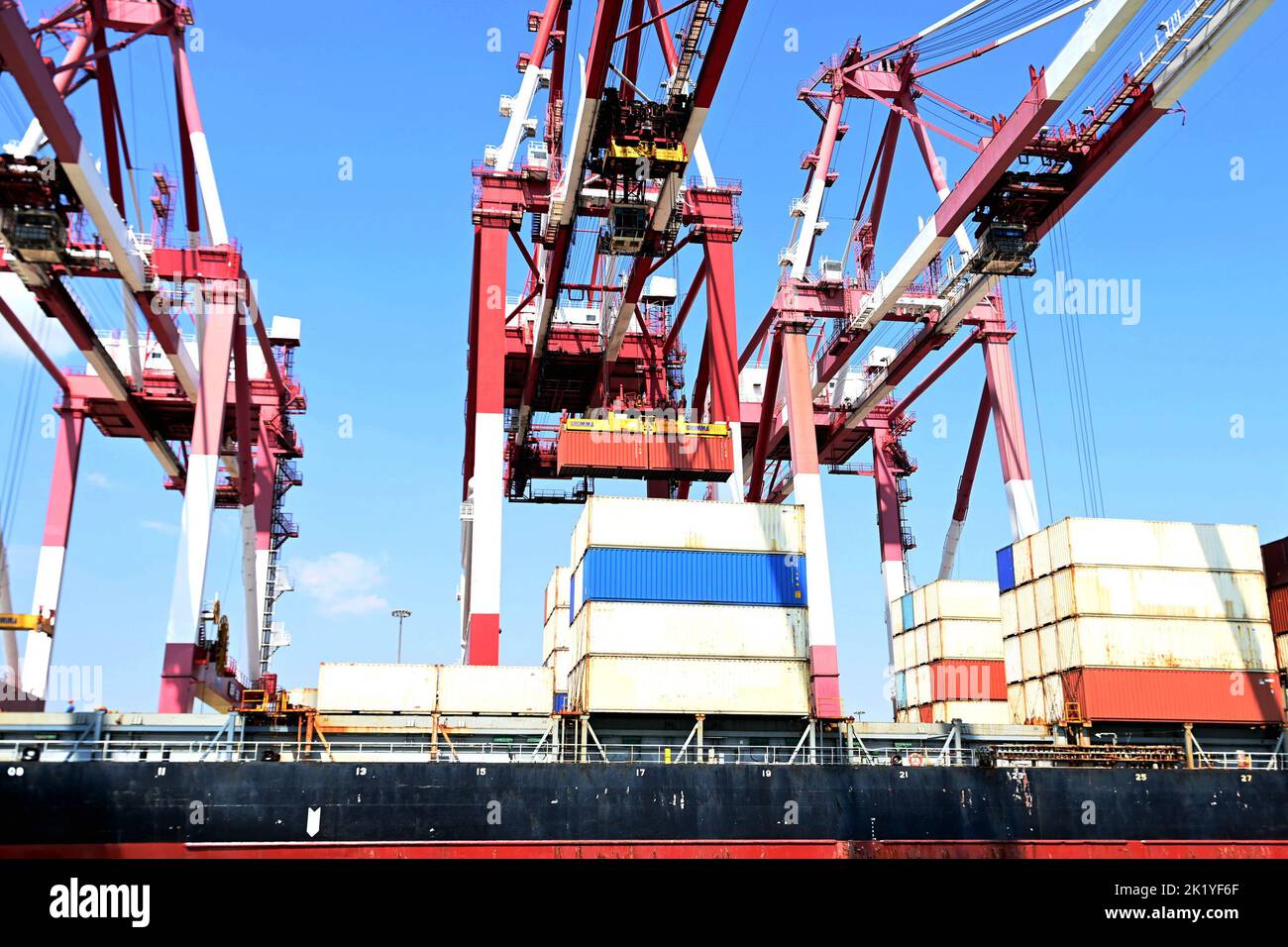 QINGDAO, CHINA - SEPTEMBER 21, 2022 - Freighters load and unload containers at the Qianwan ...
