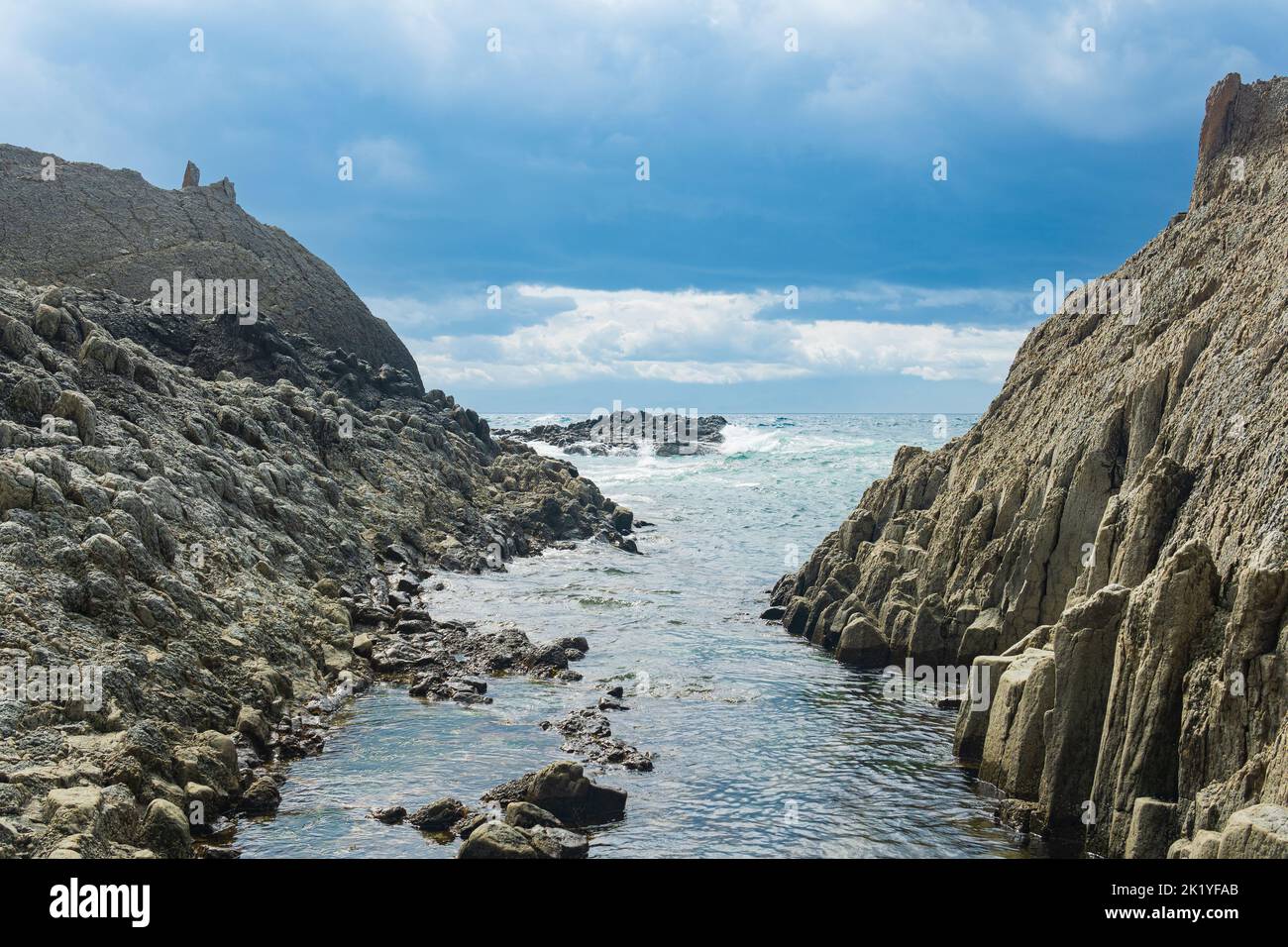 coastal cliffs formed by columnar basalt at low tide Stock Photo - Alamy