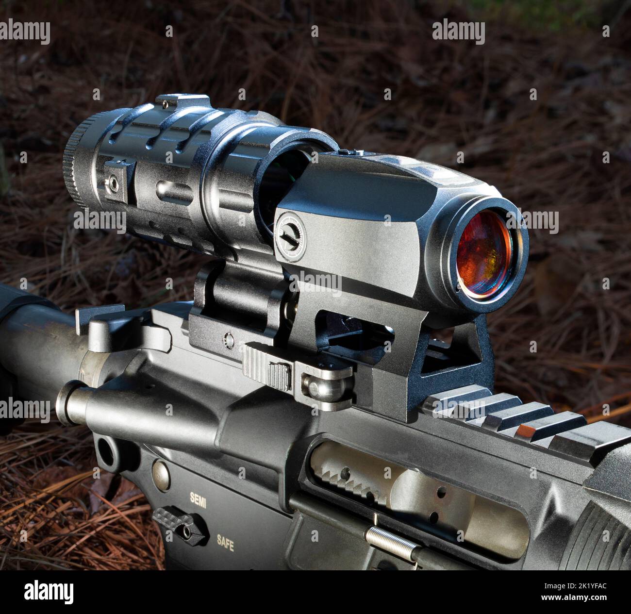 Magnifier on a red dot sight on an AR-15 outdoors Stock Photo - Alamy