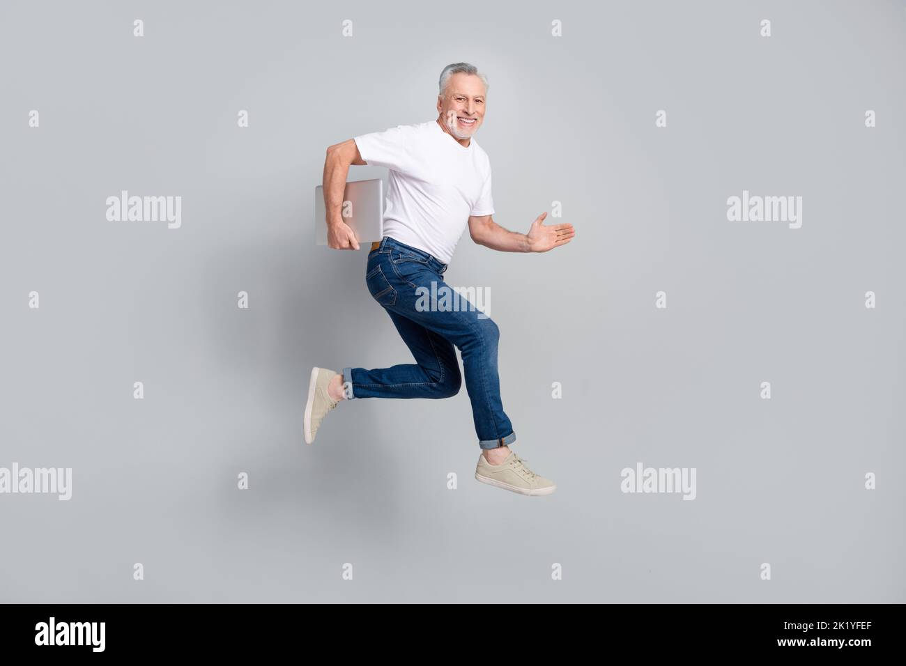 Full length body size view of handsome cheerful man jumping running ...