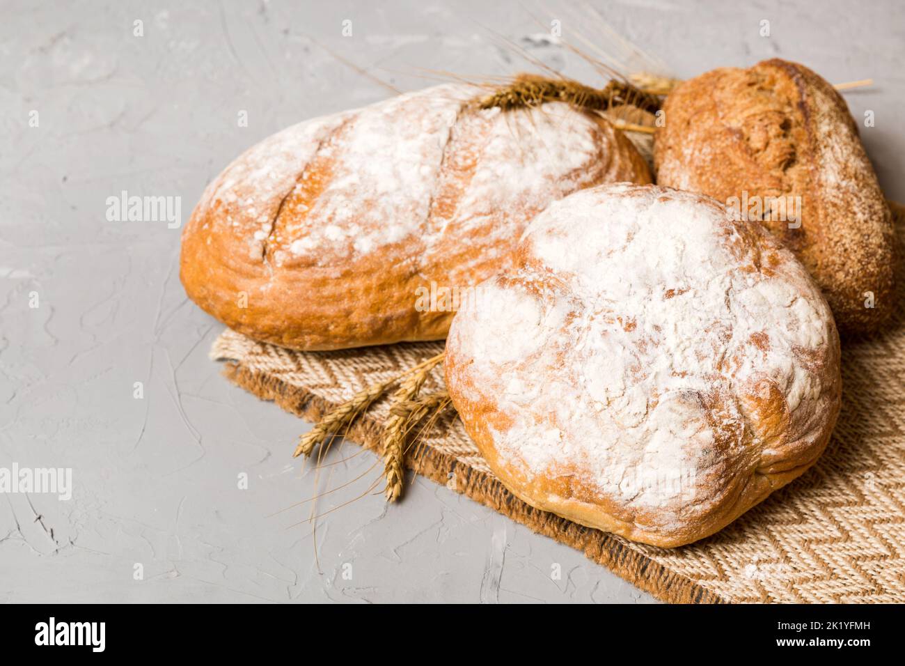 Homemade natural breads. Different kinds of fresh bread as background ...