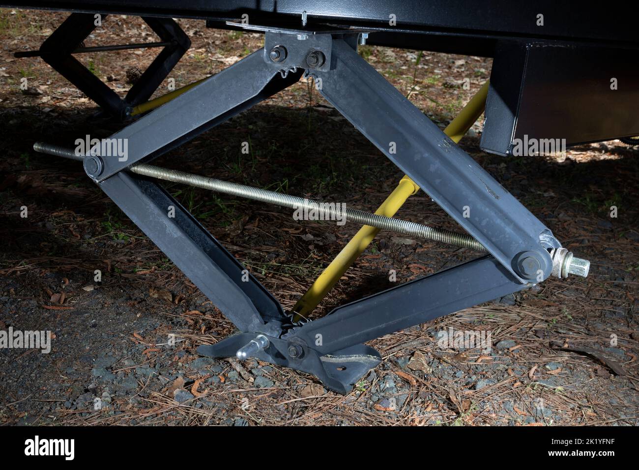 Outrigger on a camper trailer extended to the ground Stock Photo - Alamy
