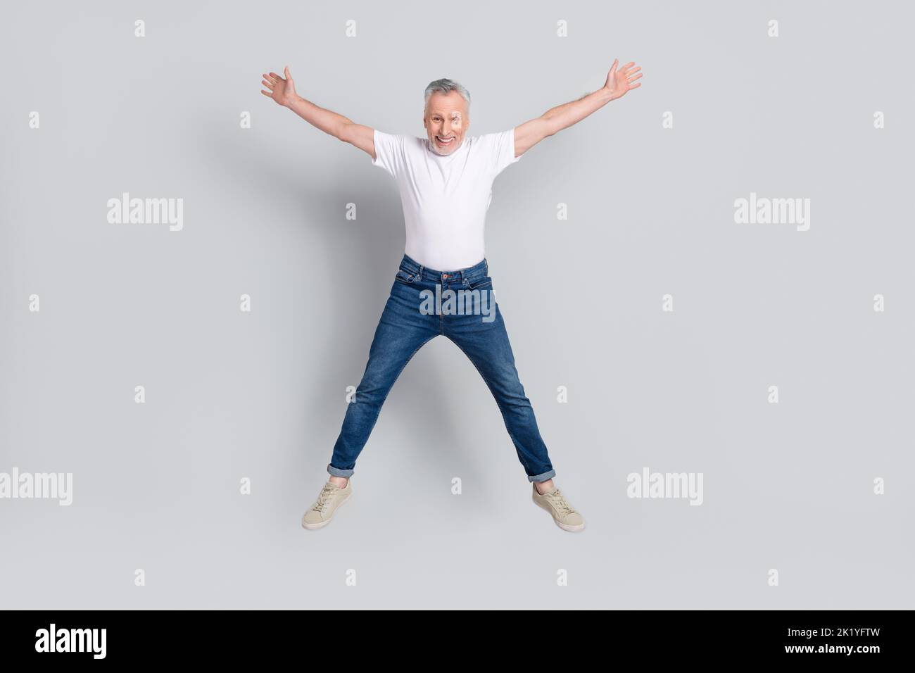 Full length body size view of attractive cheery crazy lucky man jumping ...