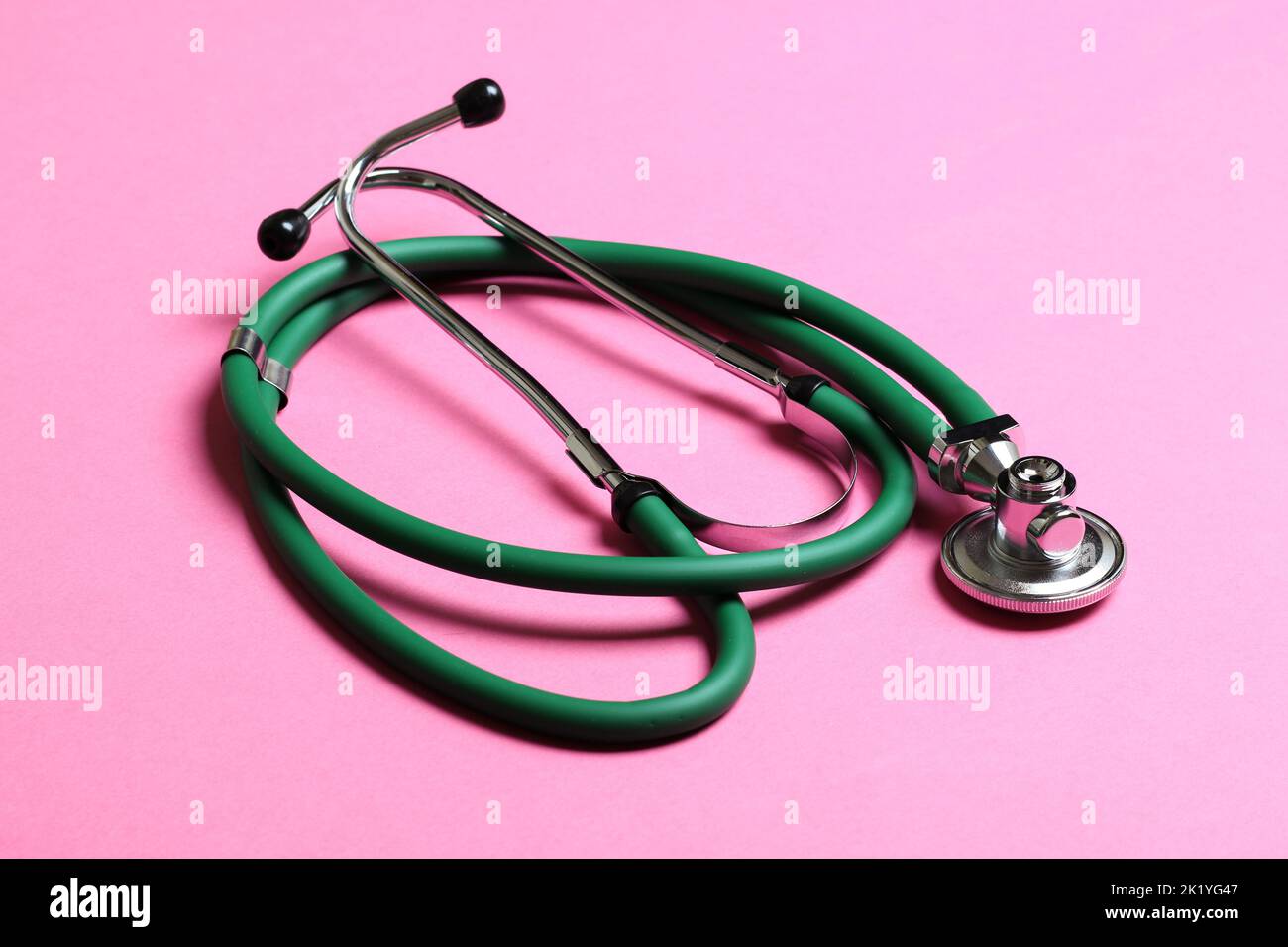 Top view of green stethoscope on colorful background. Medical diagnosis ...