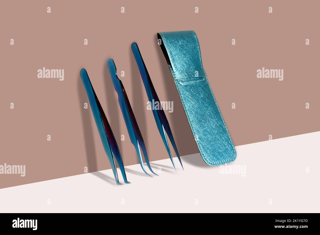 Commercial photo of three blue eyelash tweezers and blue tweezer bag ...