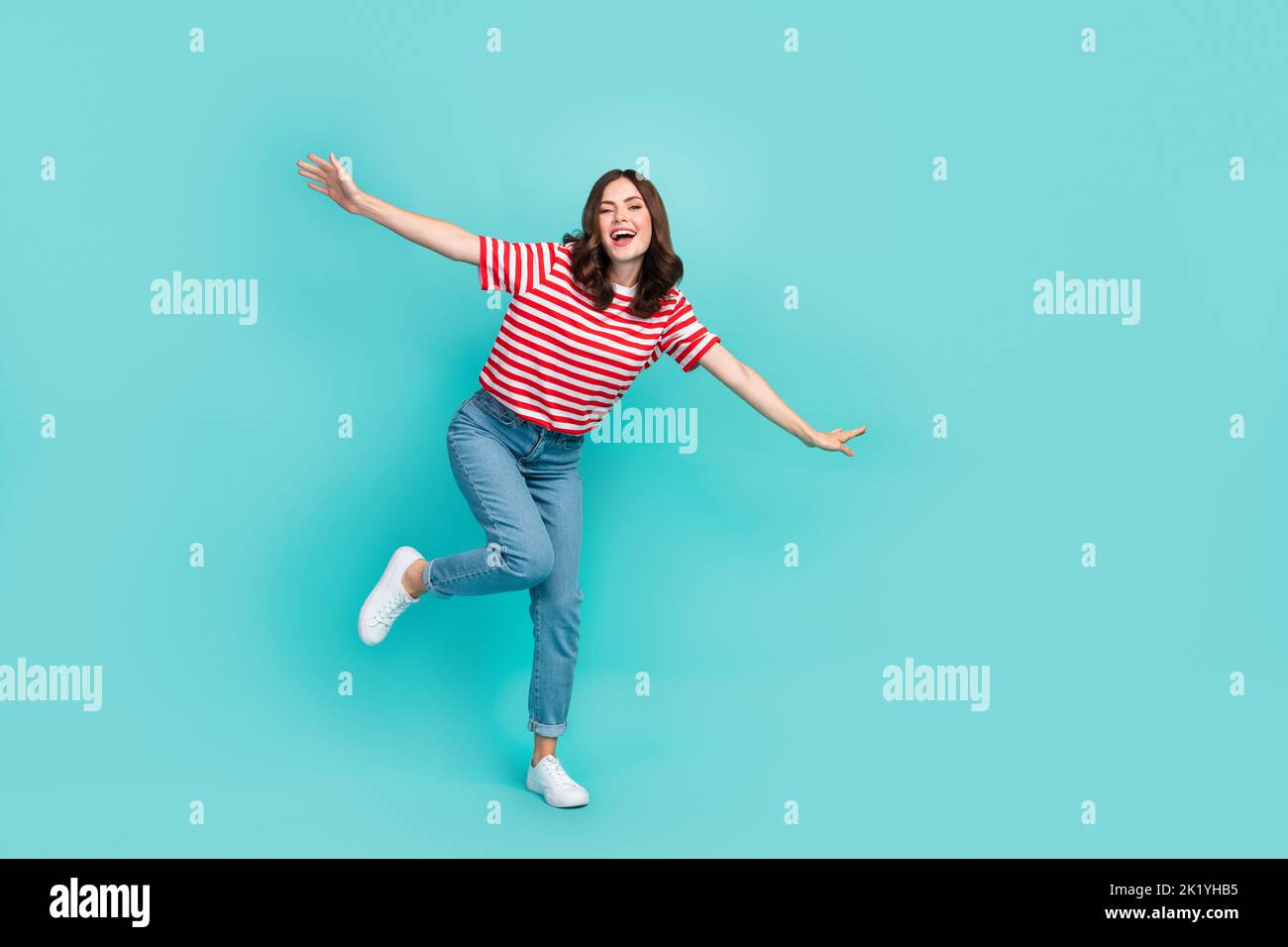 Full length photo of cheerful pretty lady imagine dream trip plane wing ...