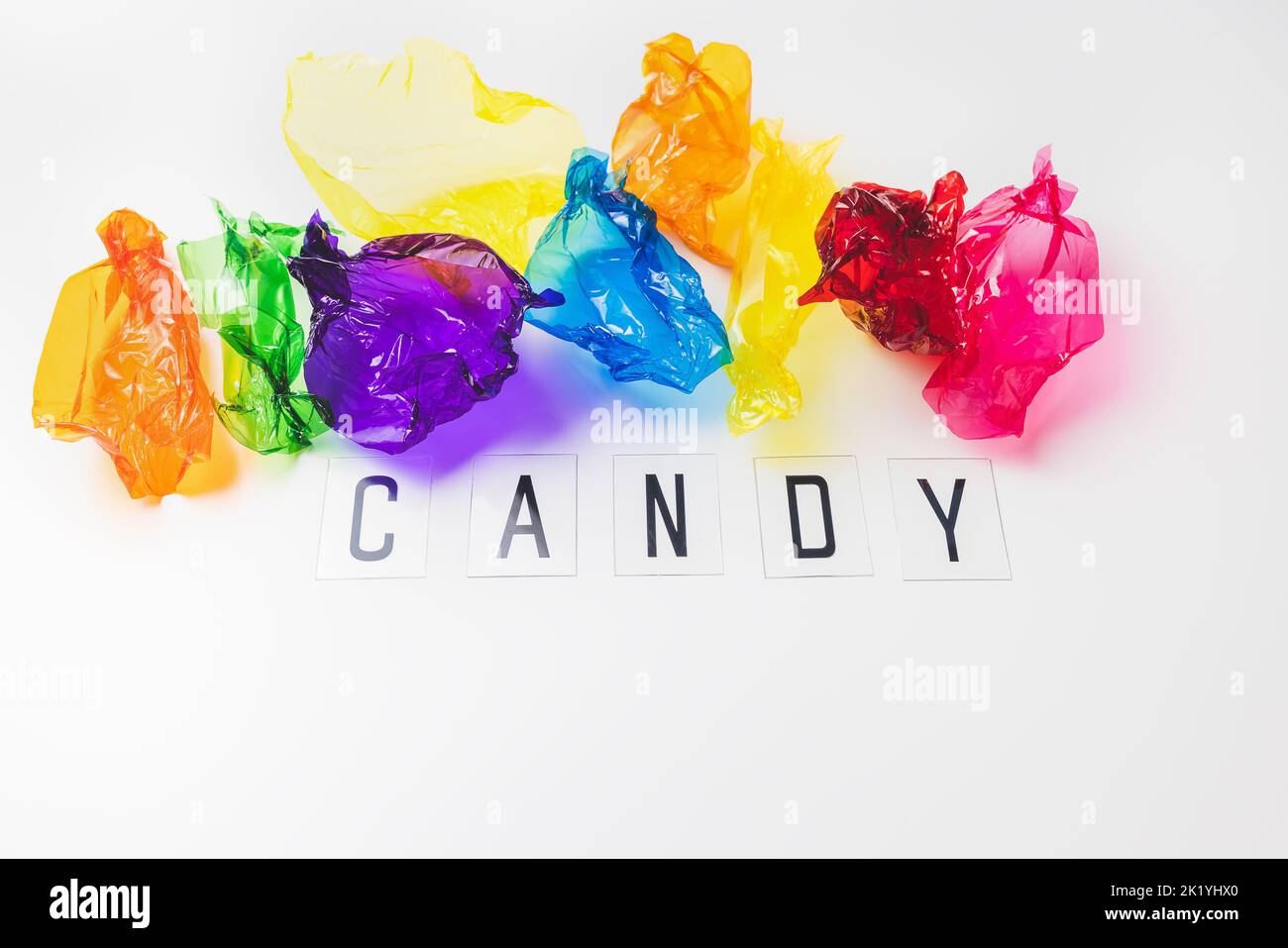 Colorful candy wrappers and text CANDY on white. Sugar sweets concept ...