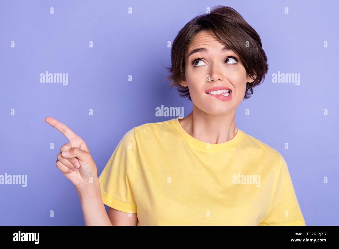 Photo of pretty nervous person biting lips look indicate finger empty ...