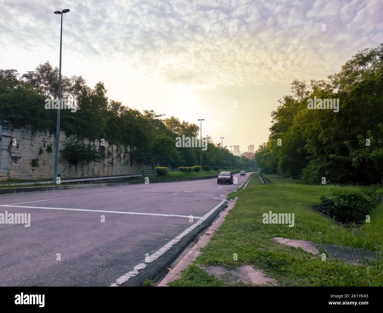 Beautiful residential area, clean empty asphalt roads, lush trees ...