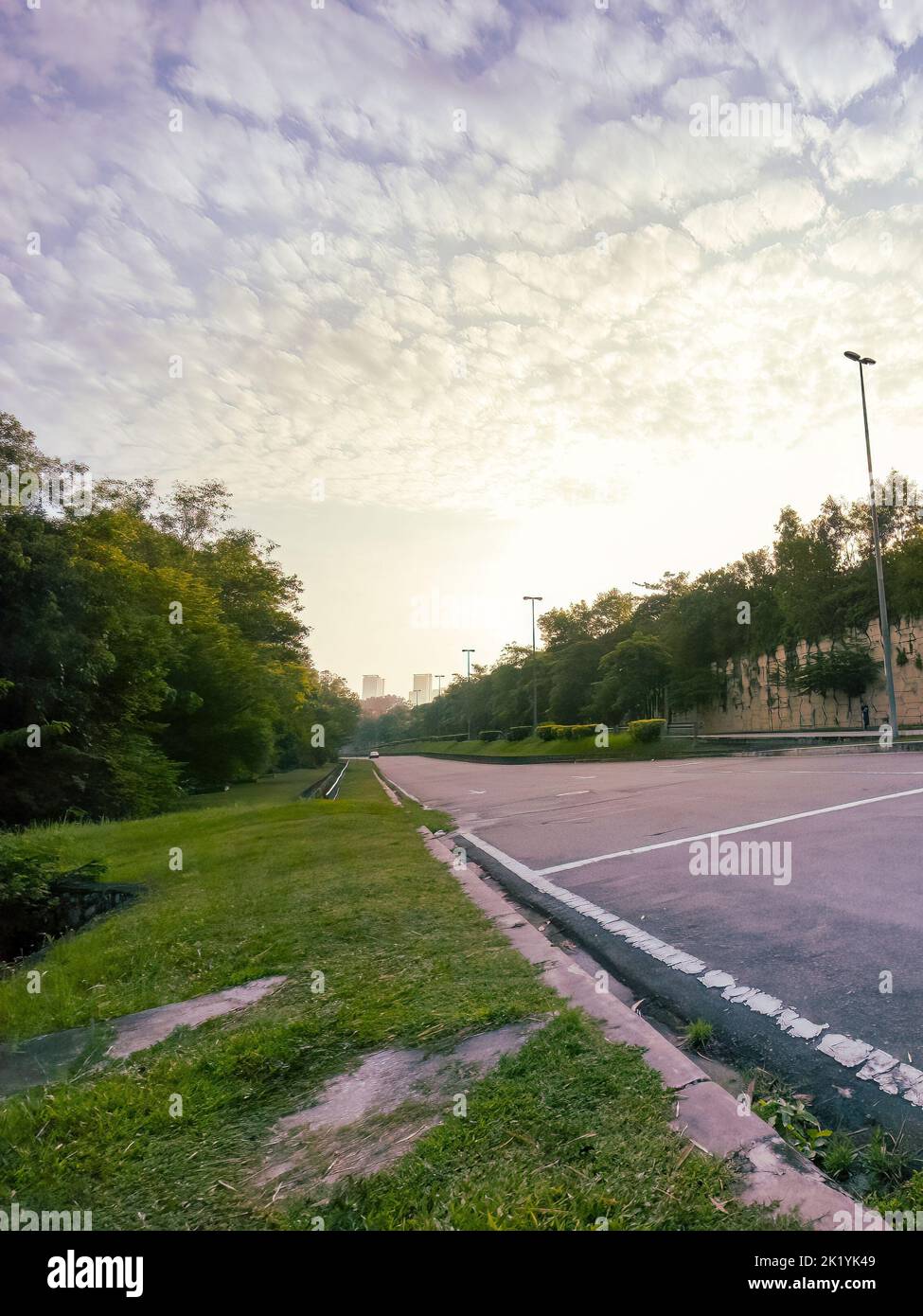 Beautiful residential area, clean empty asphalt roads, lush trees ...