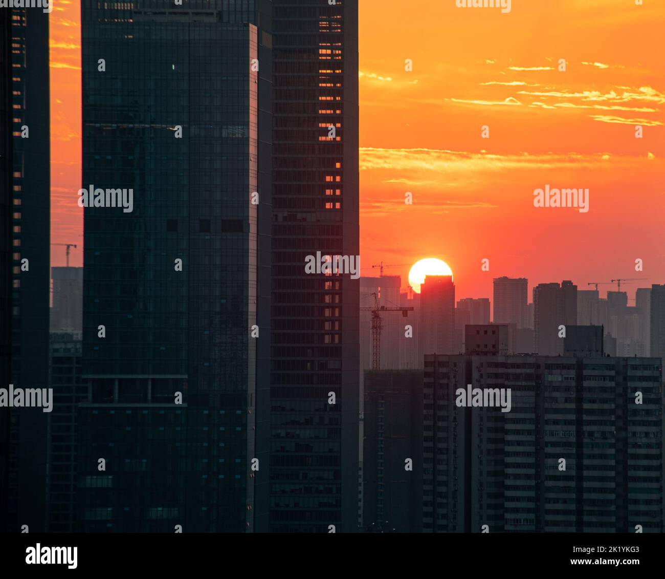 Orange sunset behind modern skyscrapers hi-res stock photography and ...