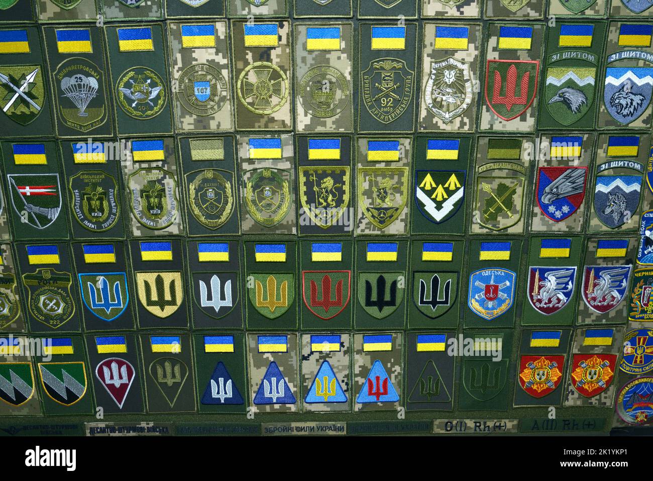 New modern chevrons of Ukrainian army presented on stand. Arms and ...