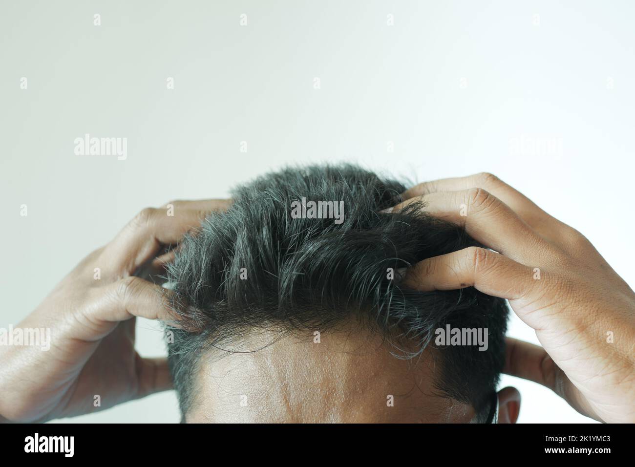 men Scratching Head Against white background Stock Photo - Alamy