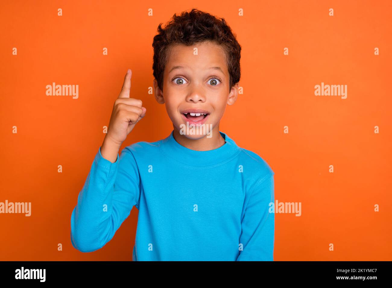 Photo portrait of charming small boy finger point up excellent idea ...