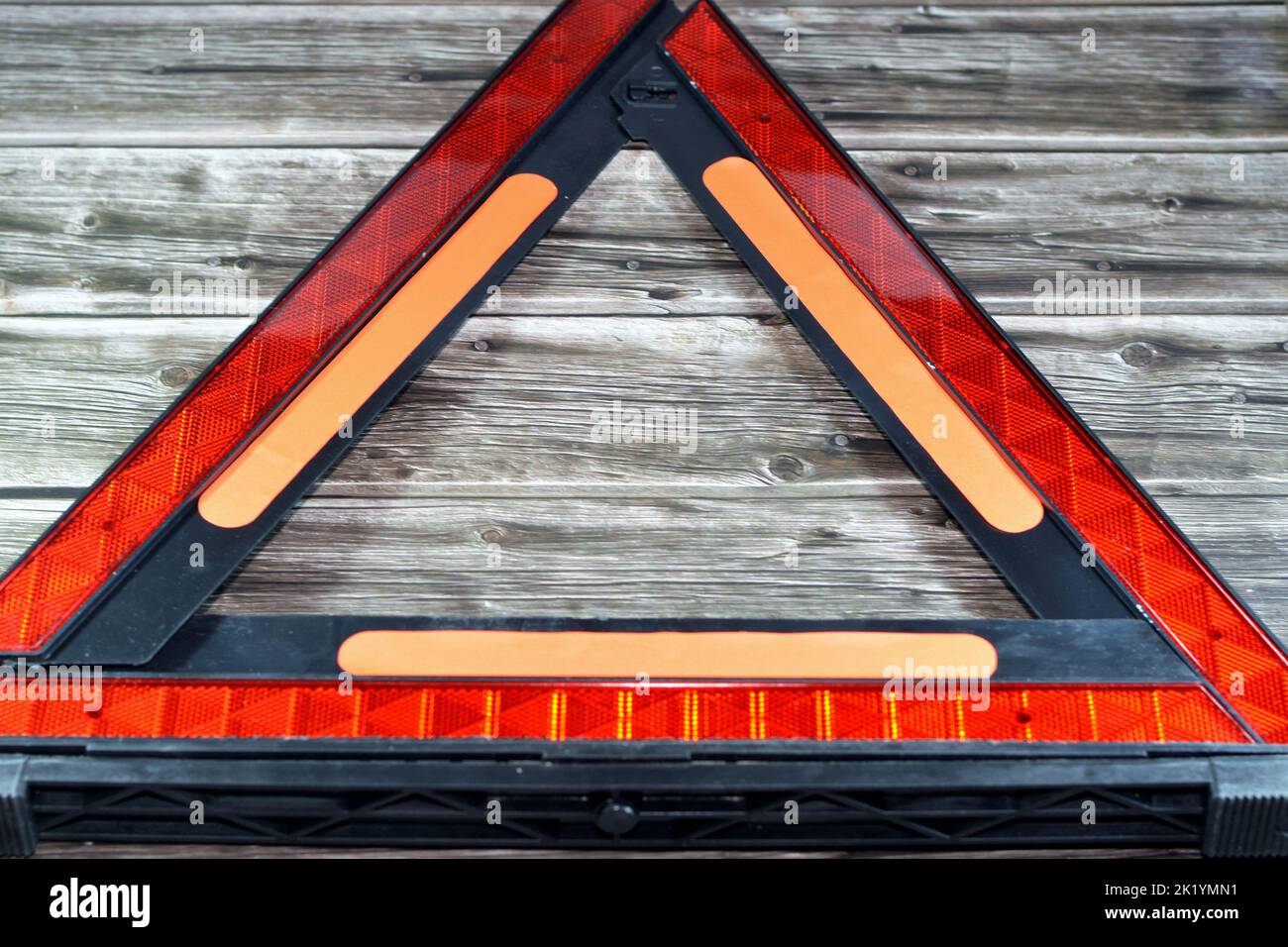 A warning foldaway reflective road hazard warning triangle isolated on ...