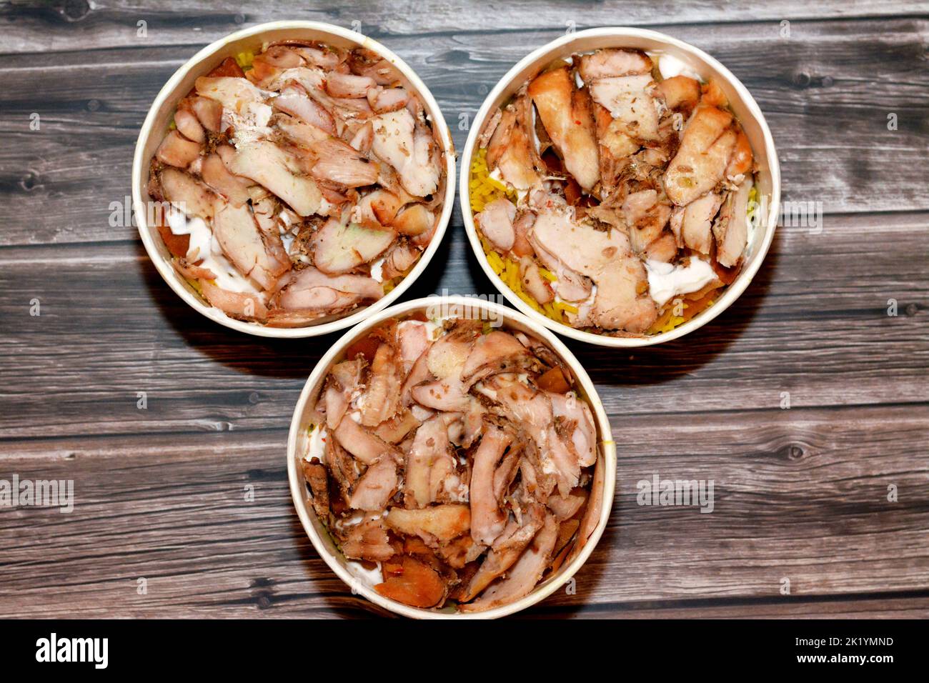 Pieces of Chicken shawarma with yellow Basmati rice, Syrian bread and ...