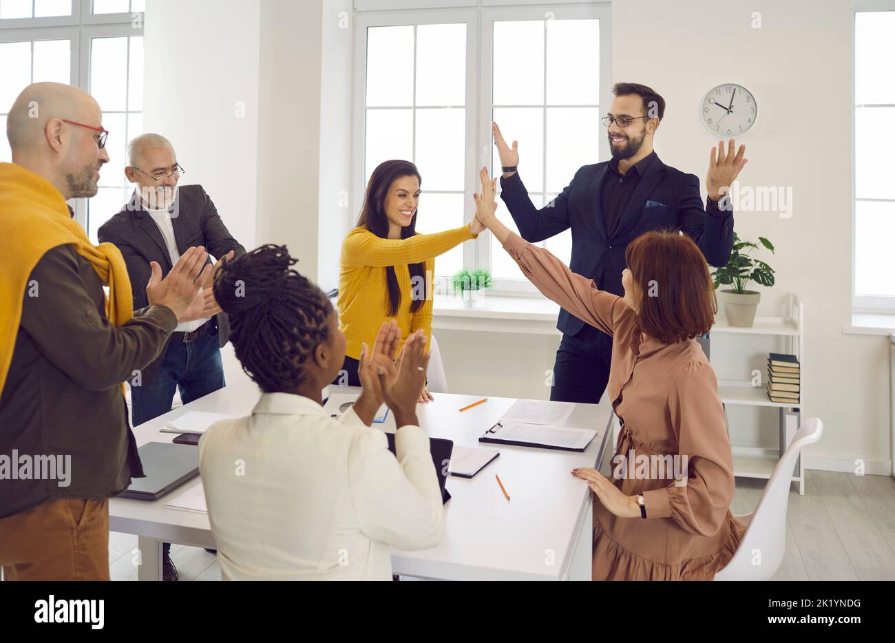Team of happy business people celebrating their success during a work ...
