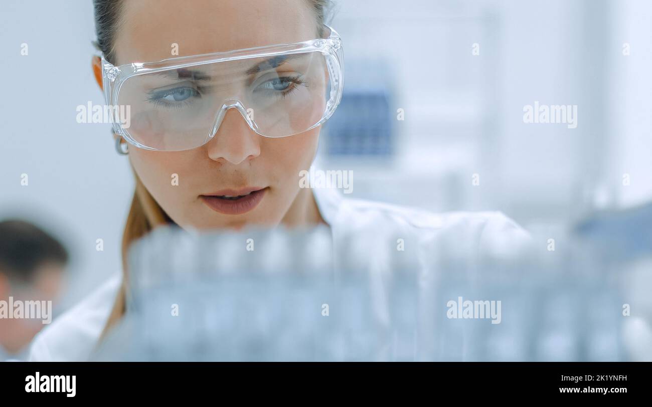 Test tube in scientist hand in laboratory Stock Photo - Alamy