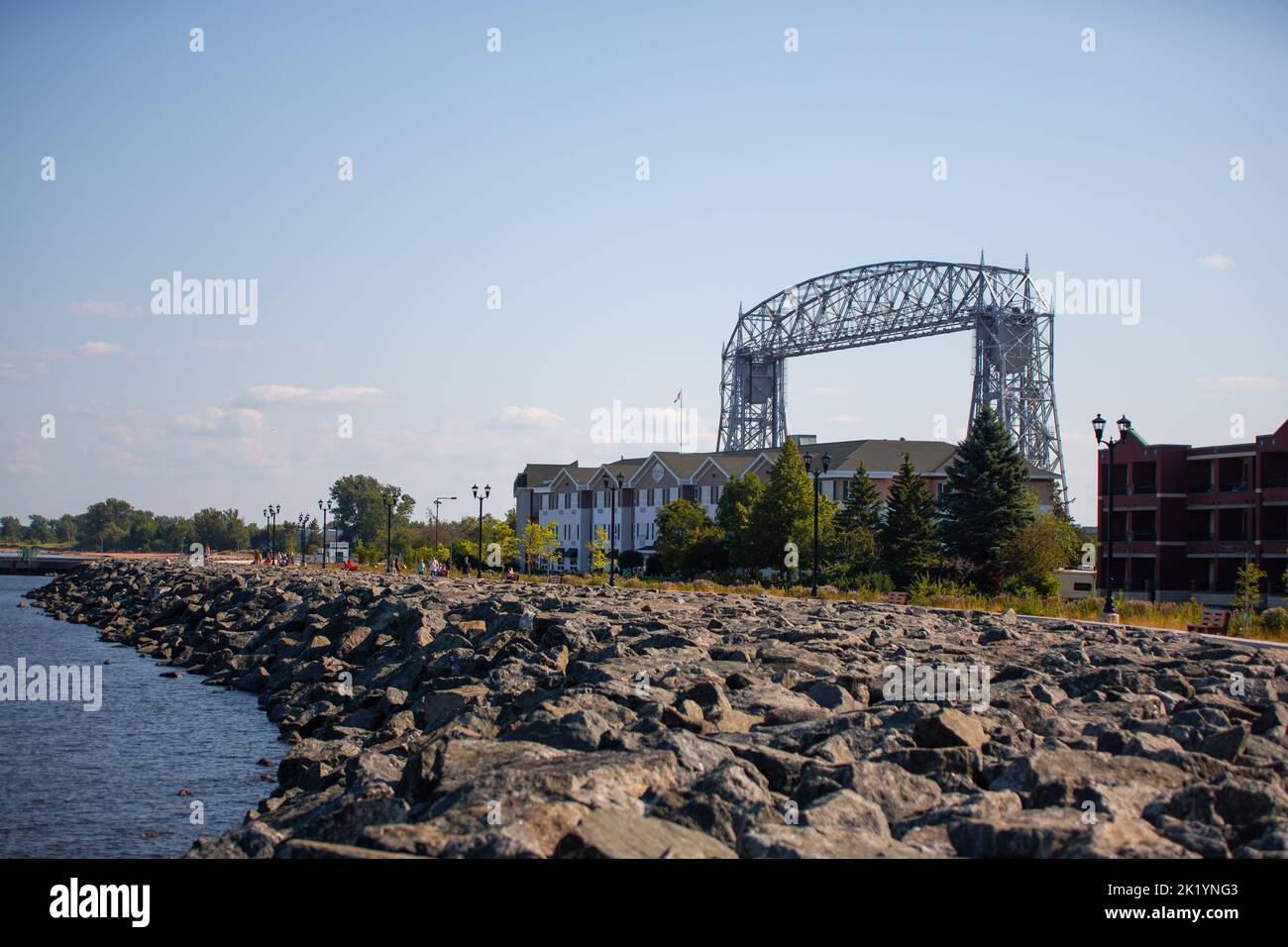 The Duluth Aerial Lift bridge on the coast of Lake Superior with rocks ...