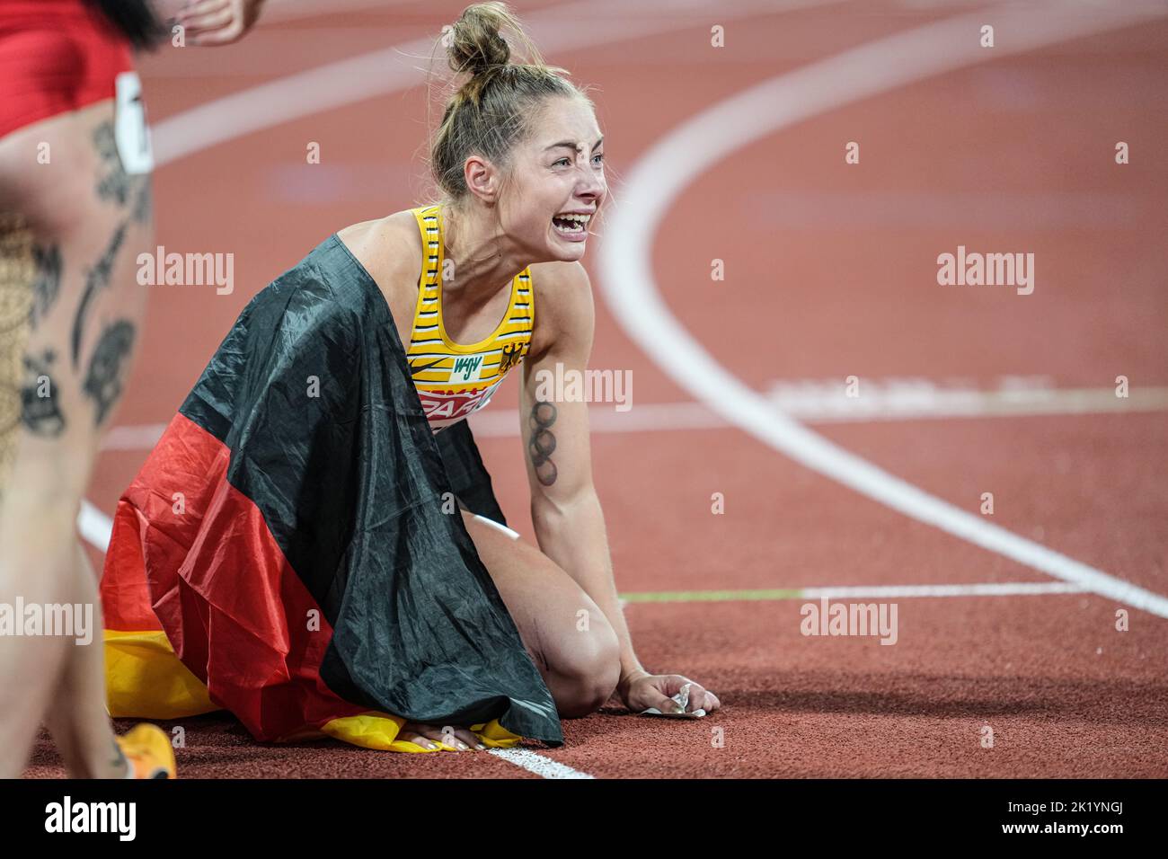 Gina Lückenkemper with her country's flag as the winner of the 100 ...