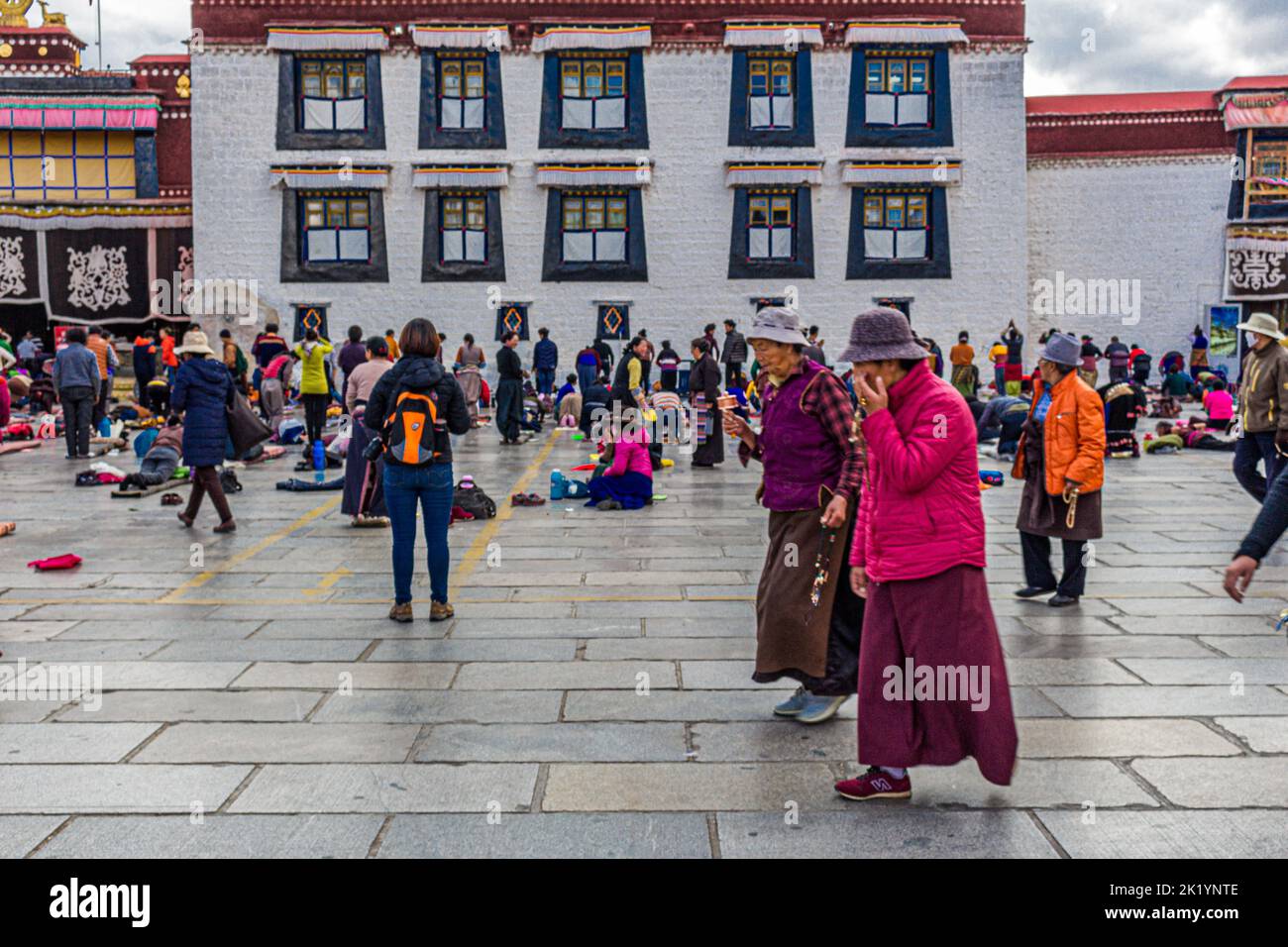 Tibetan buddhist pilgrims undertake the Kora clockwise circumambulation ...