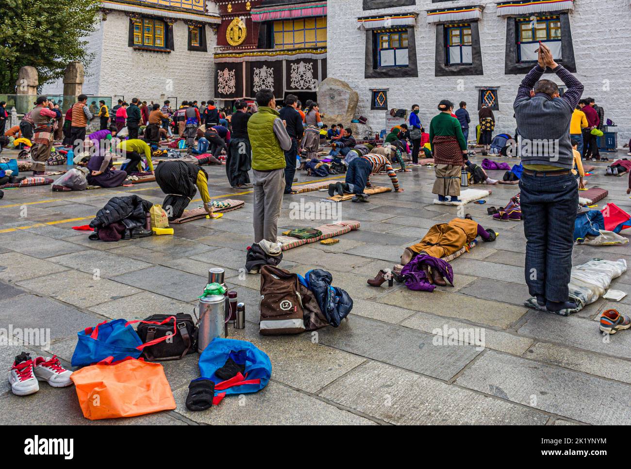 Tibetan buddhist pilgrims undertake the Kora clockwise circumambulation ...