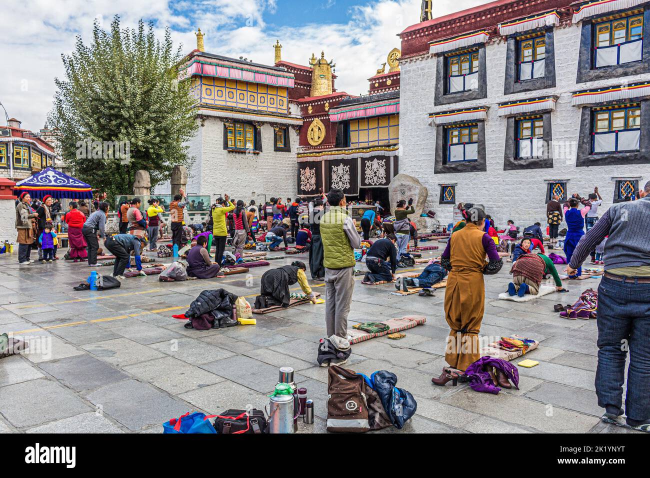 Tibetan buddhist pilgrims undertake the Kora clockwise circumambulation ...