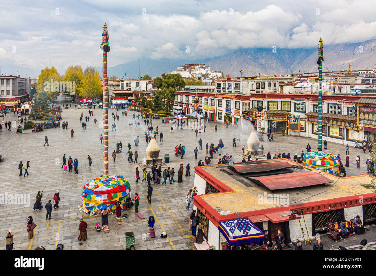 Tibetan buddhist pilgrims undertake the Kora clockwise circumambulation ...