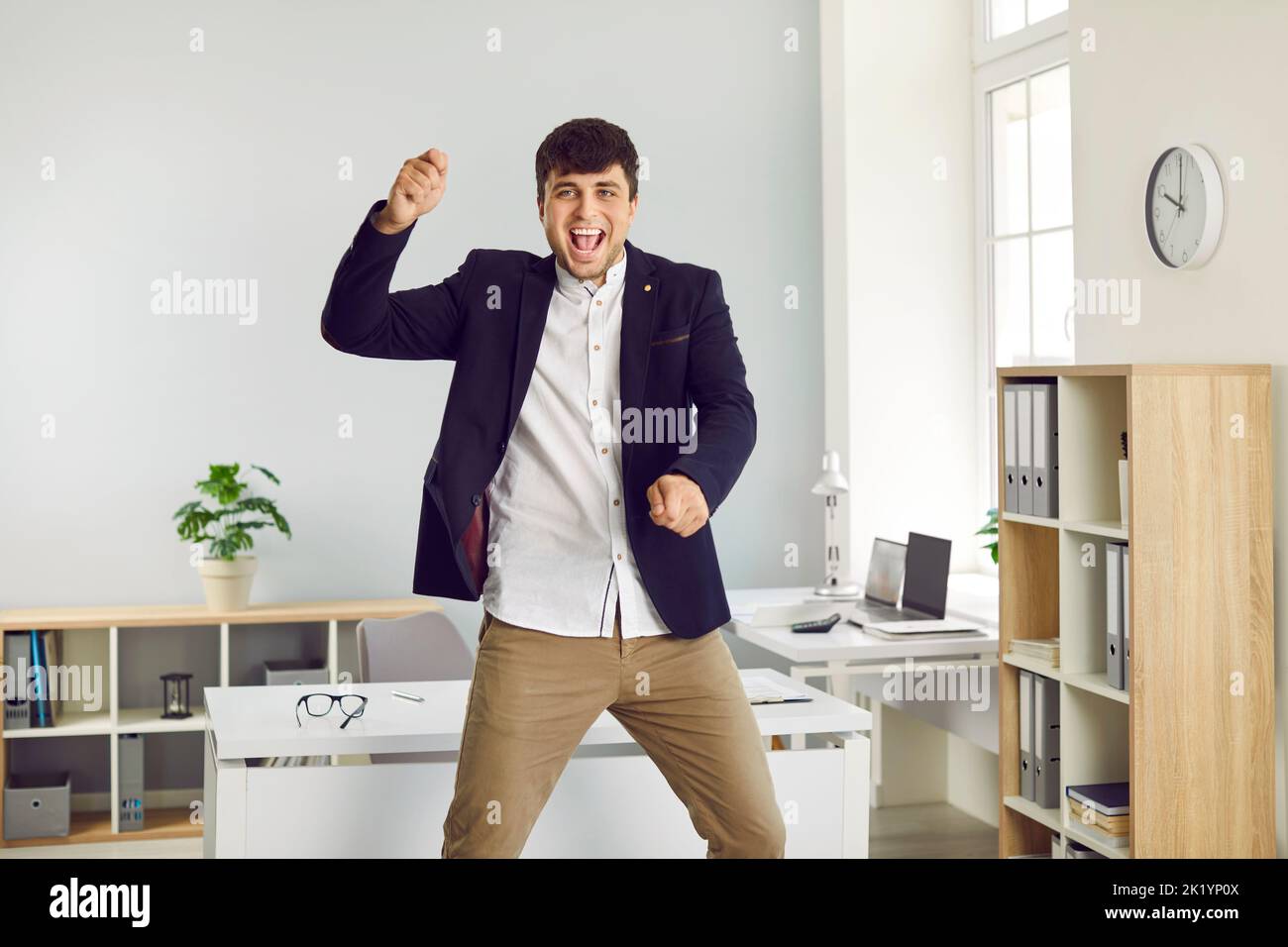 Happy office worker dancing gangnam style and having fun at the end of ...